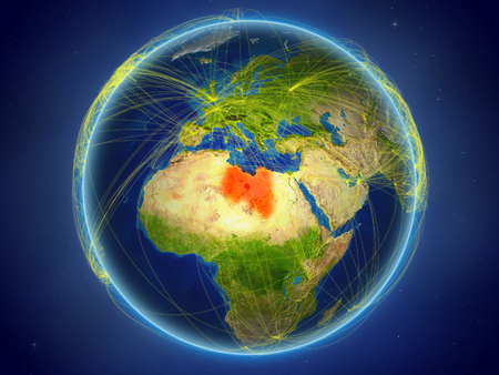 Libya from space on planet Earth with digital network representing ...