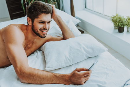 New technology in our lifestyle. Close up portrait of happy young man ...
