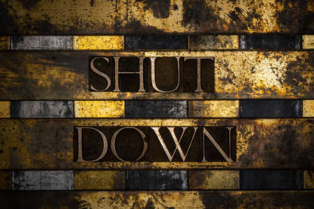 Shut Down text message on vintage textured grunge copper and gold ...