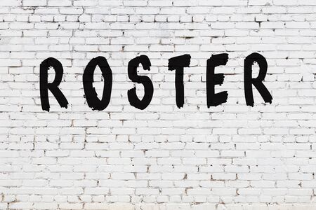Word roster written with black paint on white brick wall.の素材 ...