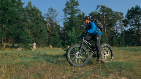 Fat bike also called fatbike or fat-tire bike in summer riding in the ...