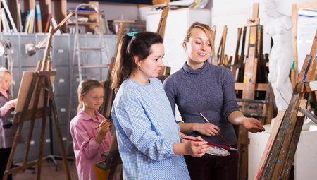 Girls working at painting class - Stock Image - Everypixel