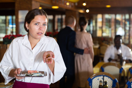 Waiter demonstrating his upset with little tips from restaurant ...