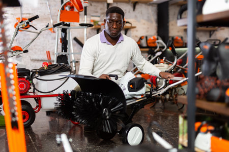 Man selecting electrical tools for gardeningの素材 [FY310199231782] | ストック ...