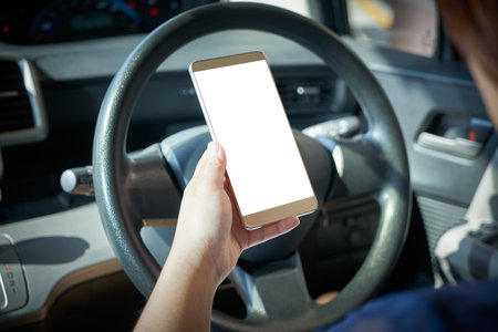 Woman driver using smart phone in car during traffic jam , blank white ...