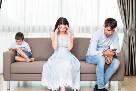 Family members distracted by technology phone and lifestyle concept ...