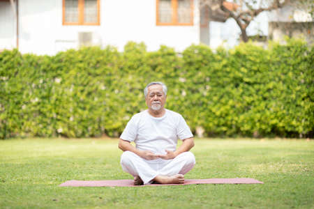 Calm of Healthy Asian Elderly man with white hairs doing yoga lotus ...
