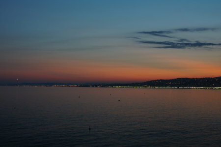 sunset over the Angels Bay,in the city of Niceの写真素材 [40011858327] - イメージマート