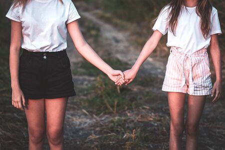 Two girls holding hands Images - Search Images on Everypixel