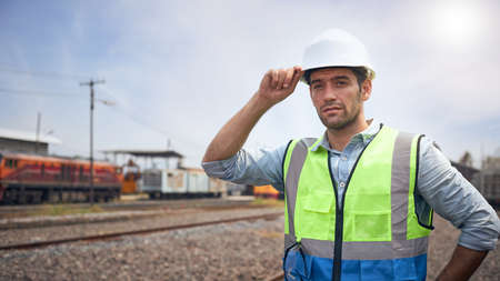Successful Rail logistics specialists or train engineers wearing ...