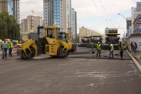 Kyiv, Ukraine Jul 2016: Road Paving, construction. Workers laying stone ...