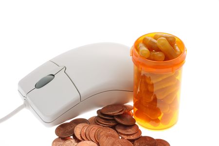 Computer mouse, pill bottle with pills in it, and penniesの写真素材 ...