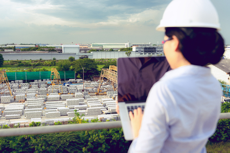 Portrait of engineer woman is using laptop inspection precast concrete ...