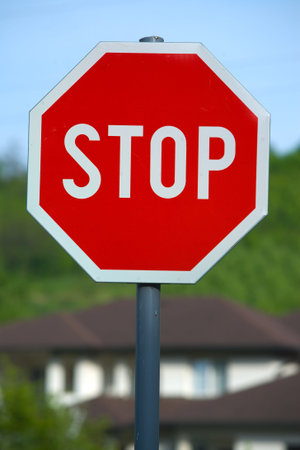 Stop sign and house exterior in the background.の写真素材 [40006925166 ...