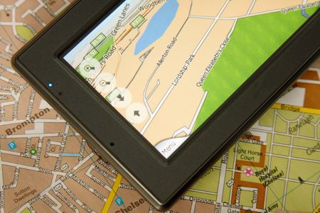 A GPS mobile (navigation device) and old traditional mapの写真素材 ...