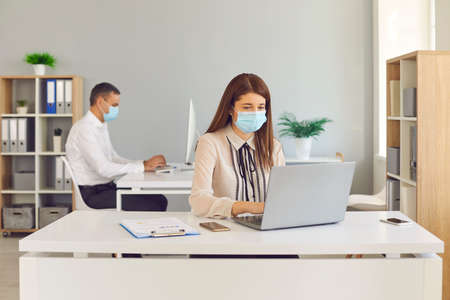 New realities of ordinary life in a pandemic. Female office worker in ...