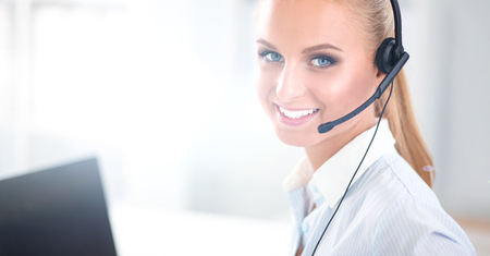 Close-up portrait of a customer service agent sitting at office - Stock ...