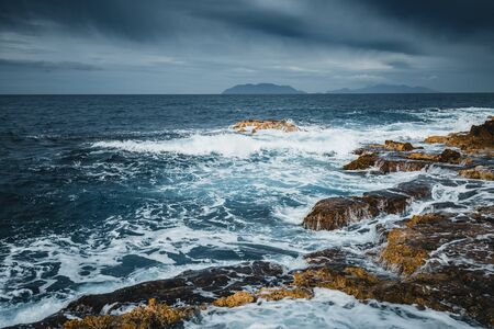 Amazing view of stormy sea with big restless waves and ominous sky ...