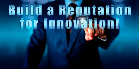 Business man is pushing Build a Reputation for Innovation! on a control ...