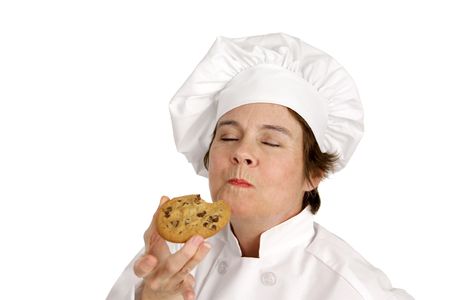 Chef enjoying a delicious chocolate chip cookie she just baked ...