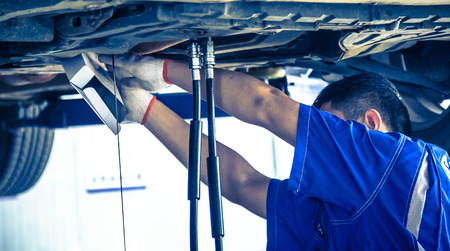 Auto repair factory parked engine,Workers concentrate on work. - Stock ...