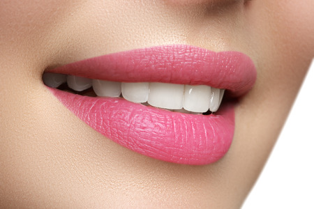 Macro happy woman's smile with healthy white teeth, bright pink .lips ...