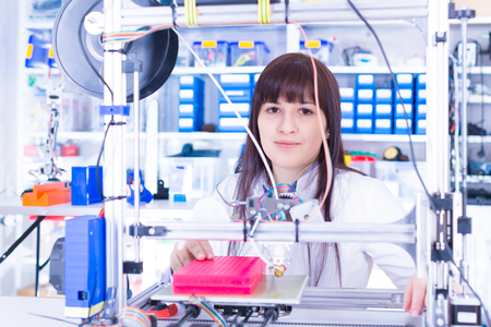 A female student or laboratory assistant in the automation laboratory ...
