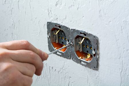 Socket plug installation. Disassembled electrical outlet in detonation ...
