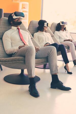 Customers testing VR product for business. Man and women wearing ...