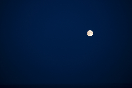 A full little moon on a blue sky and nothing elseの写真素材 [40110383361 ...
