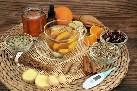 Herbal remedy for cold flu virus with hot soothing drink with fresh ...