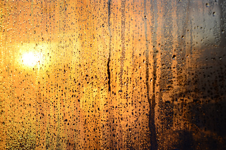The texture of misted glass with a lot of drops and drips of ...