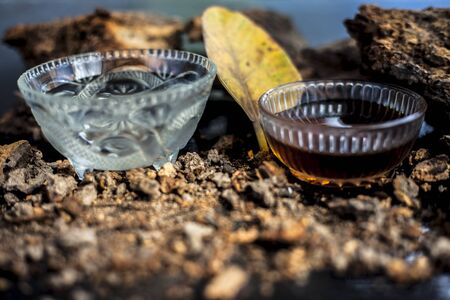 Home remedy for sexually transmitted diseases on a black glossy surface ...