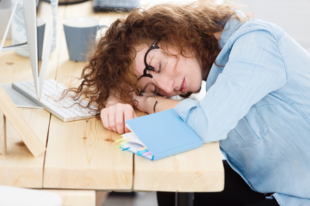 Close up portrait of tired sleepy freelancer working at desk in the ...