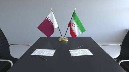 Flags and papers on the table. Negotiations and signing a contract ...