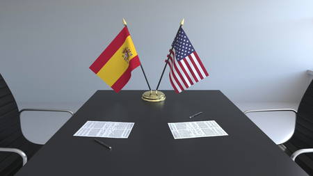 Flags and papers on the table. Negotiations and signing a contract ...
