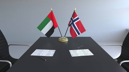 Flags and papers on the table. Negotiations and signing a contract ...