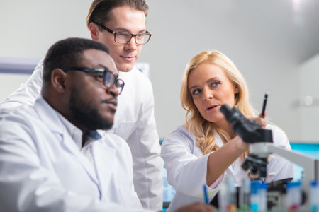 Professional team of scientists is working on a vaccine in a modern ...