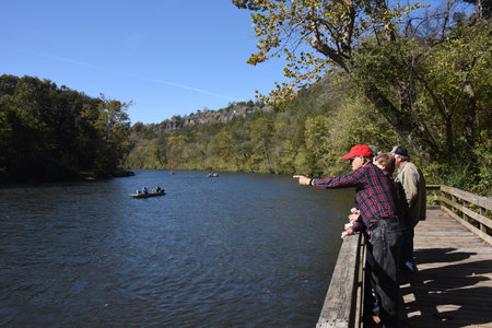 Visitors stand on the viewing dock at River Ridge, North Fork of the ...