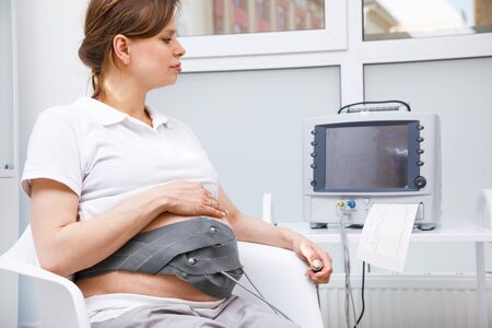 Photo of Pregnant woman sitting in - ID:1-127753390 - Royalty Free ...