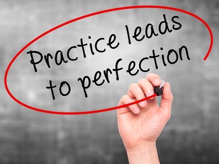 Man Hand writing Practice leads to perfection with black marker on ...