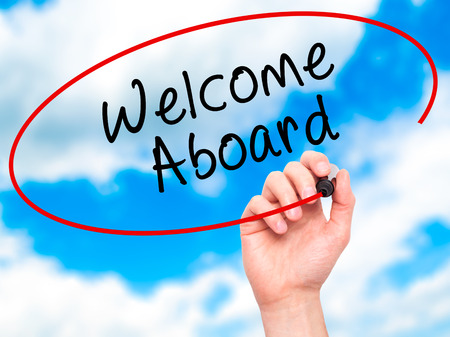 Man hand writing Welcome Aboard on visual screen. Business,help ...