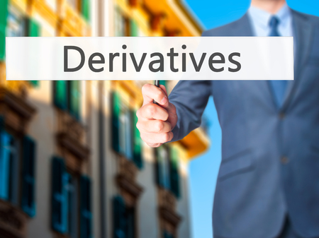 Derivatives - Businessman hand holding sign. Business, technology ...