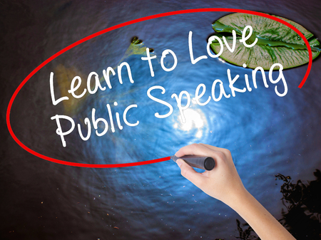 Woman Hand Writing Learn to Love Public Speaking with marker over ...