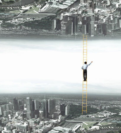 Businessman standing on ladder between two realitiesの写真素材 [40029144074 ...