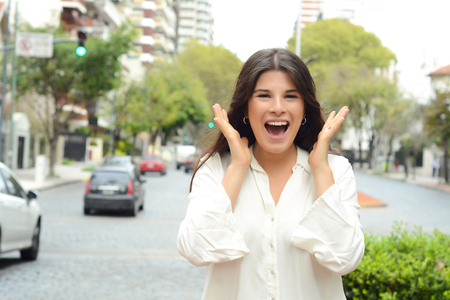 Close up portrait of a beautiful young woman with surprised expression ...