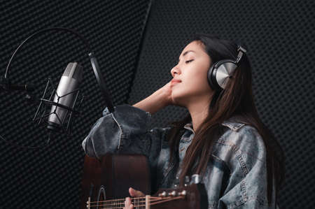 Asian female singer with a passion for music and microphone. While ...