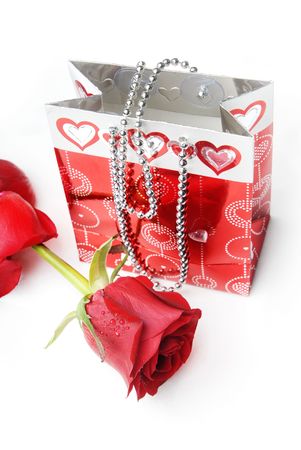 Red rose and package with hearts as a gift for Valentine dayの写真素材 ...
