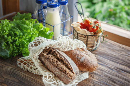 assortment of different types of bread. Fresh rye bread and ciabatta in ...