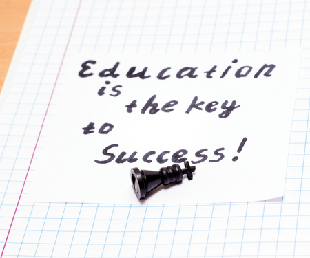 Education key to success is written in English on a sheet of paper ...